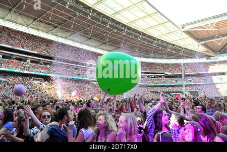 Giant inflatable balloons are passed around the crowd during Capital FM ...
