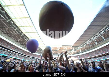 Giant inflatable balloons are passed around the crowd during Capital FM ...