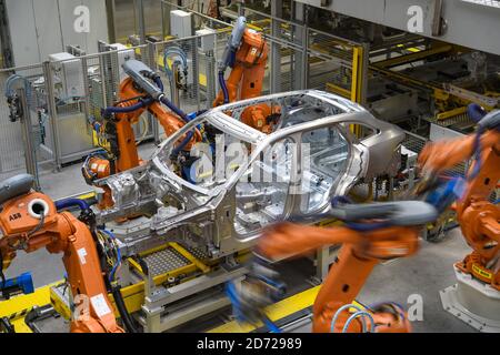 Robotic arms rivet car panels together in the Aluminium Body Shop, part ...