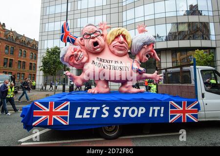 A float satirising Boris Johnson, Theresa May, David Davis and Liam Fox ...