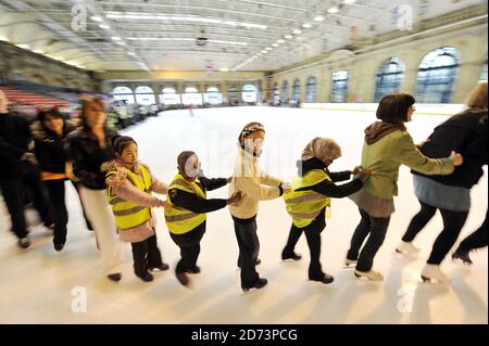 Skaters participate in a record-breaking attempt to make the longest ...