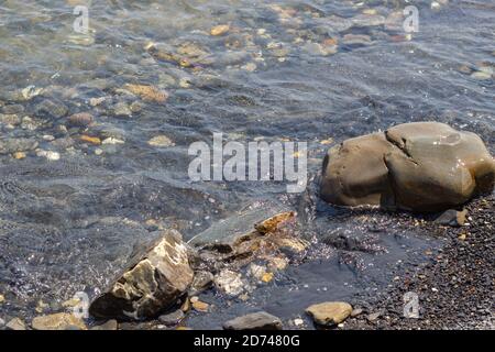 Clear sea and big stone in shape of eye. Wildlife Wunderlast Summer ...