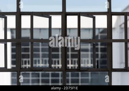 Big window front with partially opened windows of the Bauhaus in Dessau ...