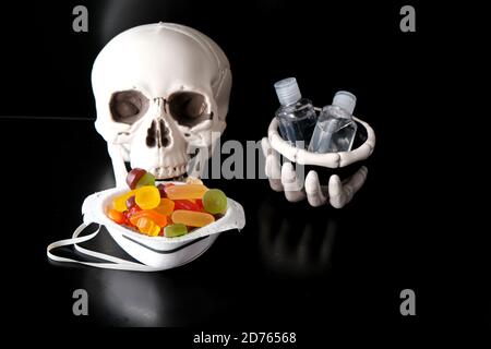 Skeleton Skull with Candy to eat during Halloween Stock Photo - Alamy