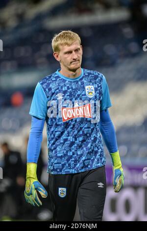 Ryan Schofield #31 of Huddersfield Town and Matty Pearson #4 of ...