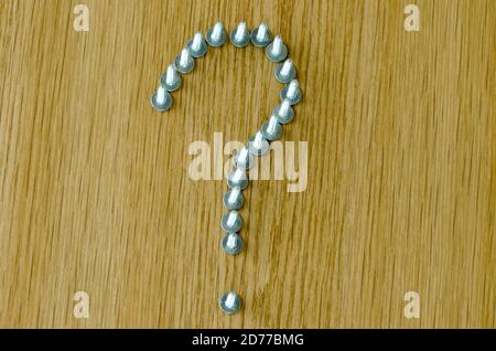 Question mark made of wood screws Stock Photo - Alamy