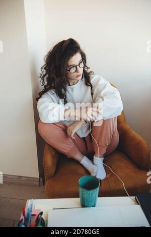 Thoughtful girl listening to the music at home Stock Photo - Alamy