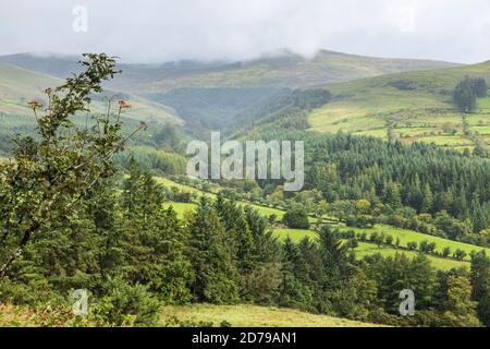 Rainclouds sweep in to the valley in the Galtee mountains, County ...