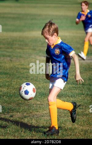 soccer action with boys ages 6 - 9 years of age Stock Photo - Alamy