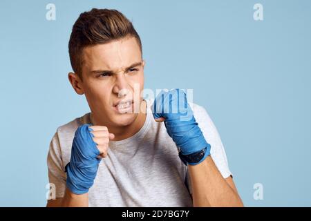 cropped man in boxing gloves and suit isolated on white background ...