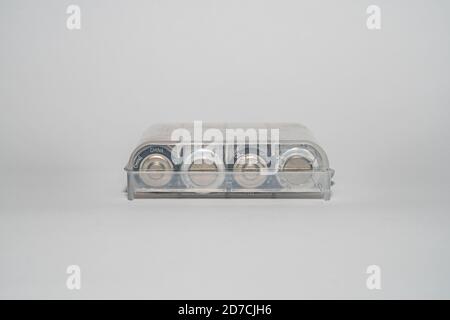 Batteries in a transparent box isolated on a white background Stock ...