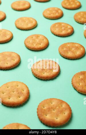 Flat lay with cracker biscuits on mint background Stock Photo - Alamy
