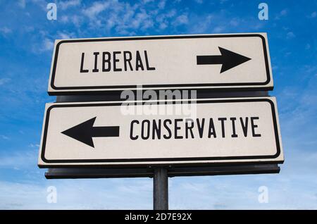 Liberal or conservative road sign on blue sky background Stock Photo ...