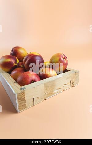 Ripe sweet juicy flat nectarines heap in the bowl Stock Photo - Alamy