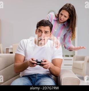 Young family suffering from computer games addiction Stock Photo - Alamy