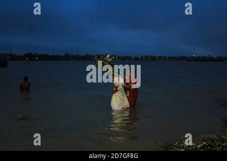 One of the first rituals of durga puja is the "Kola Bou Snan". She is ...