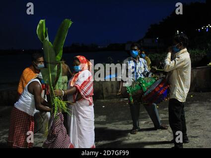 One of the first rituals of durga puja is the "Kola Bou Snan". She is ...