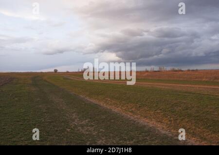 Dramatic pre-storm sky over the field. Spring landscape Stock Photo - Alamy