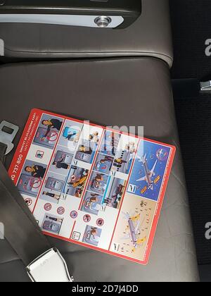 safety card and in flight magazine in seat pocket interior of jet2 ...