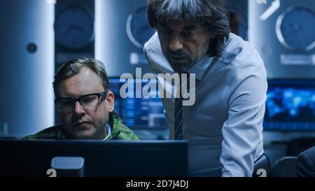 Government Chief of Cyber Security Consults Operations Officer who ...