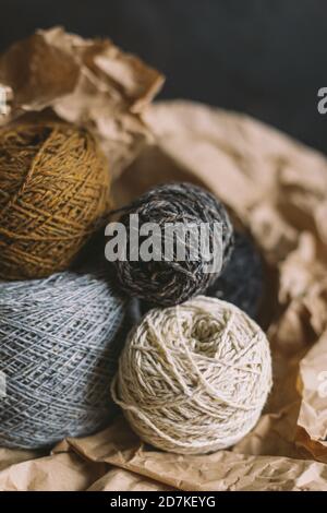 Balls of brown wool yarn made of natural wool. Needlework Stock Photo - Alamy