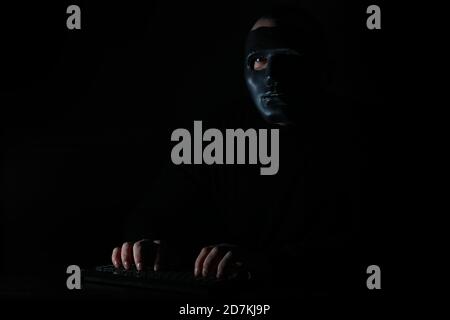 portrait of hacker with mask and binary code background Stock Photo - Alamy