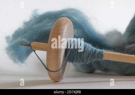 Spinning yarn using drop spindle Stock Photo - Alamy