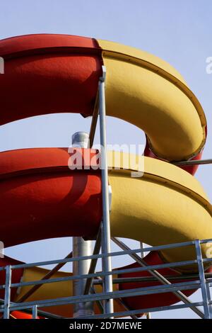 Vertical closeup shot of a turning red and yellow waterslide Stock ...