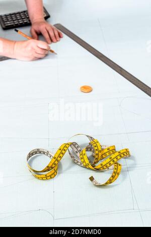 dress pattern at graph paper and tailors shears, ruler, measure tapes ...