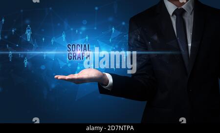 Elegant hand holding SOCIAL GRAPH inscription, social networking ...