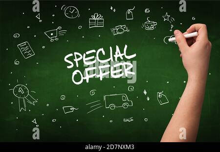 Hand drawing SPECIAL OFFER inscription with white chalk on blackboard ...
