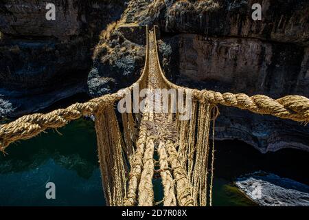 Qu'eswachaka suspension bridge, rope bridge made of woven Peruvian ...