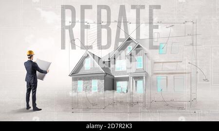 Young engineer holding blueprint with REBATE inscription, house ...