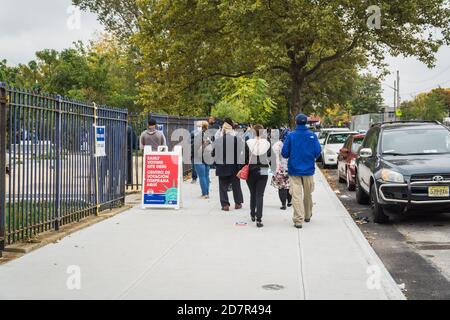 Bronx, United States. 24th Oct, 2020. Voters wait for hours on long ...