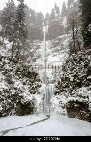 Waterfall in a snowy forest in Oregon, Portland Stock Photo - Alamy