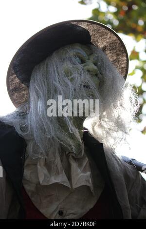 Sinister man with horrible scary Halloween zombie makeup making faces ...