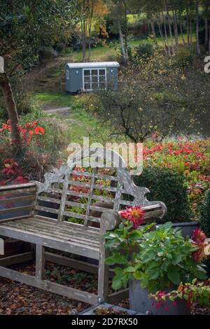 Pretty Shepherd's hut in private garden with a lake Stock Photo - Alamy
