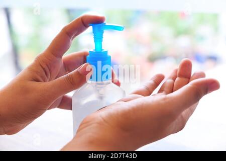 women hand using sanitizer gel for preventing virus with copy space ...