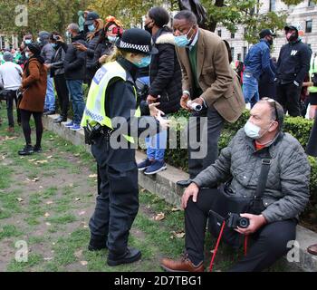 A police officer from the Territorial Support Group (TSG) carries an ...