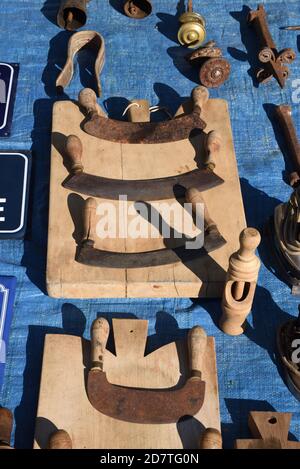 Old kitchen mezzaluna on a wooden cutting board on dark wooden ...