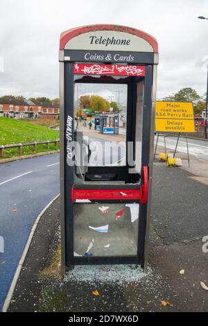 Smashed up, vandalised British telephone box with broken glass Stock ...