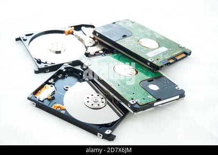 Pile of a variety of computer Hard disk drive HDD and SSD isolated on ...