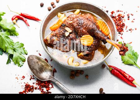 Goose soup with vegetables and pasta. A bowl of duck soup on wooden ...