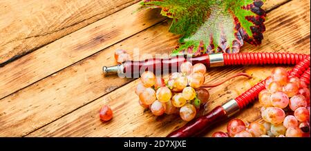 Turkish hookah with shisha tobacco with grape flavor.Space for text ...