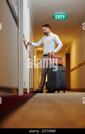 Hotel Guest entering Room Stock Photo - Alamy