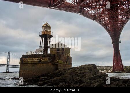 Views of Inchgarvie lighthouse and the Forth rail bridge in the Firth ...