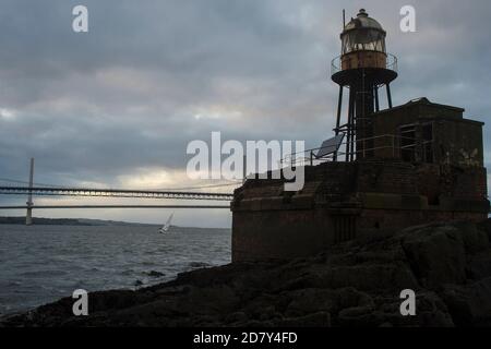 Views of Inchgarvie lighthouse and the Forth rail bridge in the Firth ...