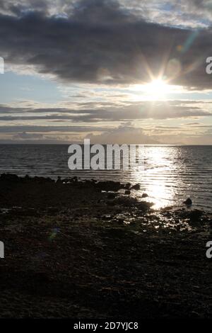 Sunset over Arran from Prestwick Beach. Ayrshire, Scotland, UK ...