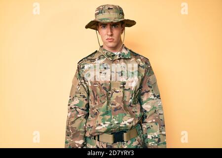 Handsome unhappy young soldier wearing uniform, depressed man suffering ...