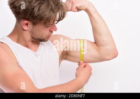 Athlete with messy hair showing biceps and triceps Stock Photo - Alamy
